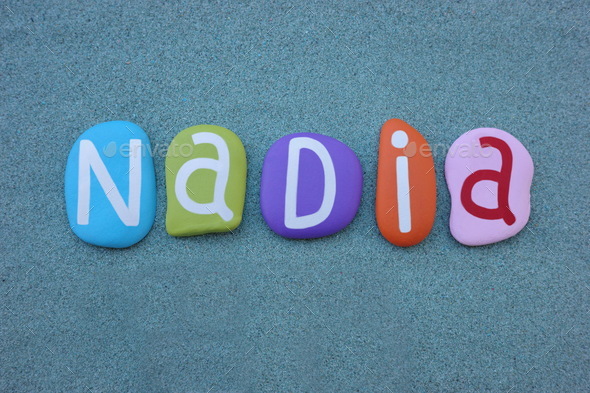 Nadia, female given name composed with multi colored stone letters over ...
