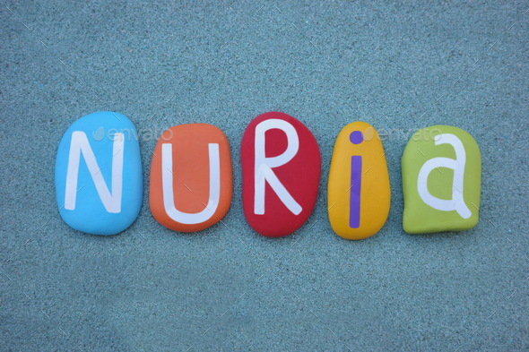 Nuria, female given name composed with multi colored stone letters over ...