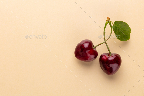 Cherry berries on a pastel background top view. Background with a ...