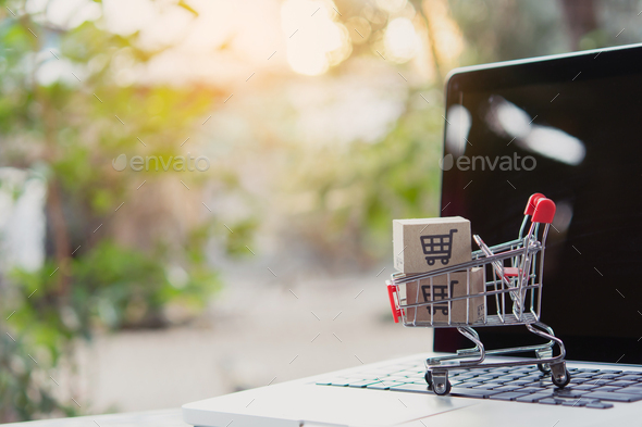 Shopping online. Cardboard box with a shopping cart logo in a trolley ...