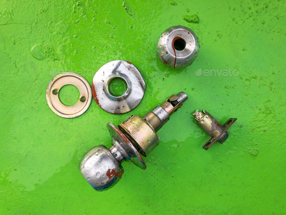 Broken door knob isolated on a green background Stock Photo by innu_asha84