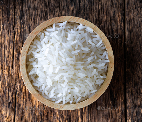 rice in wood bowl on wood Stock Photo by sommai | PhotoDune