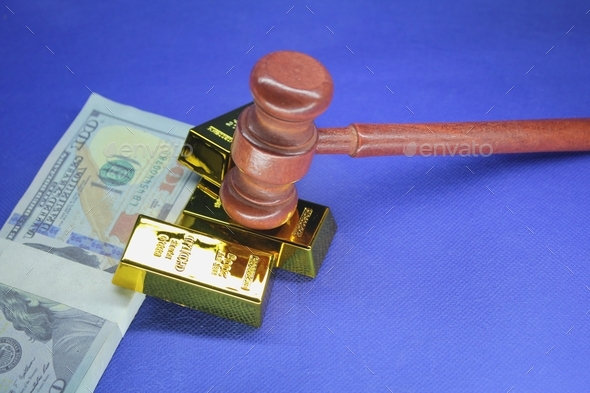 judge's gavel, paper money and gold bar with the concept of financial ...