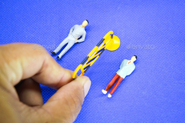 isolation of two men with a small yellow fence Stock Photo by fauziEv8