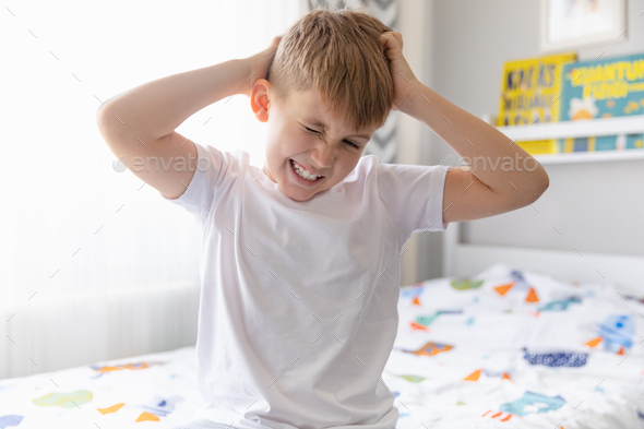 Child boy scratching his head. Cooties, skin diseases concept. Stock ...