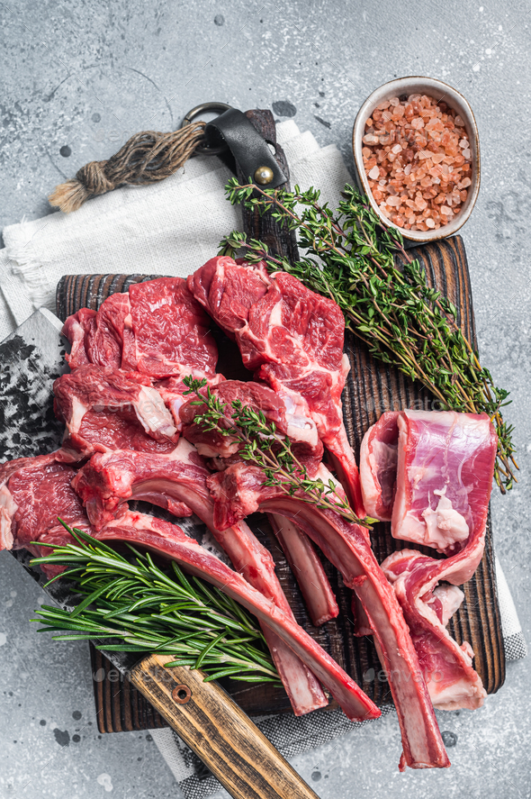 Butcher cutting board with butchered Raw Lamb chop steak or mutton ...
