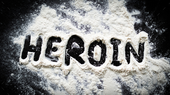 Heroin drug. powder heroin on dark black table background. Stock Photo ...