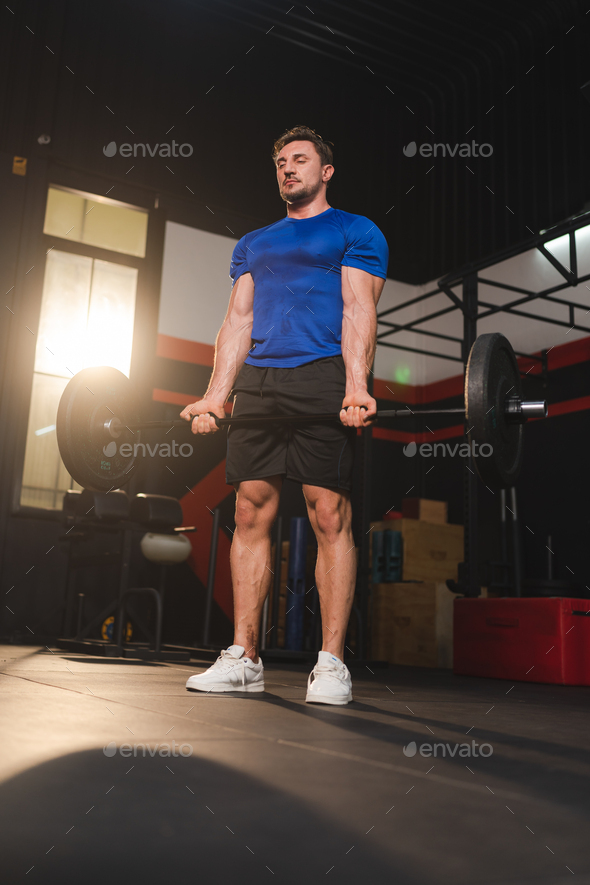 strong athlete caucasian man exercising in sport gym, workout exercise ...