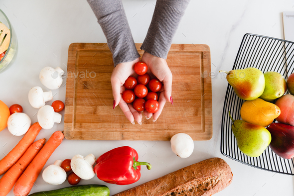 Cropped top view photo of cooking kitchen table, while chef female ...