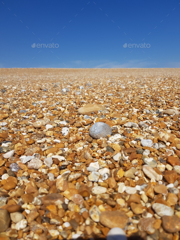Vertical pebbles close-up, selective focus. Abstract blurred texture ...