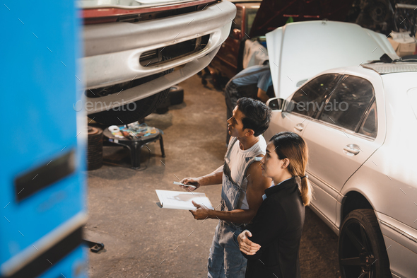 customer making inspection check to a car engine repair occupation job ...