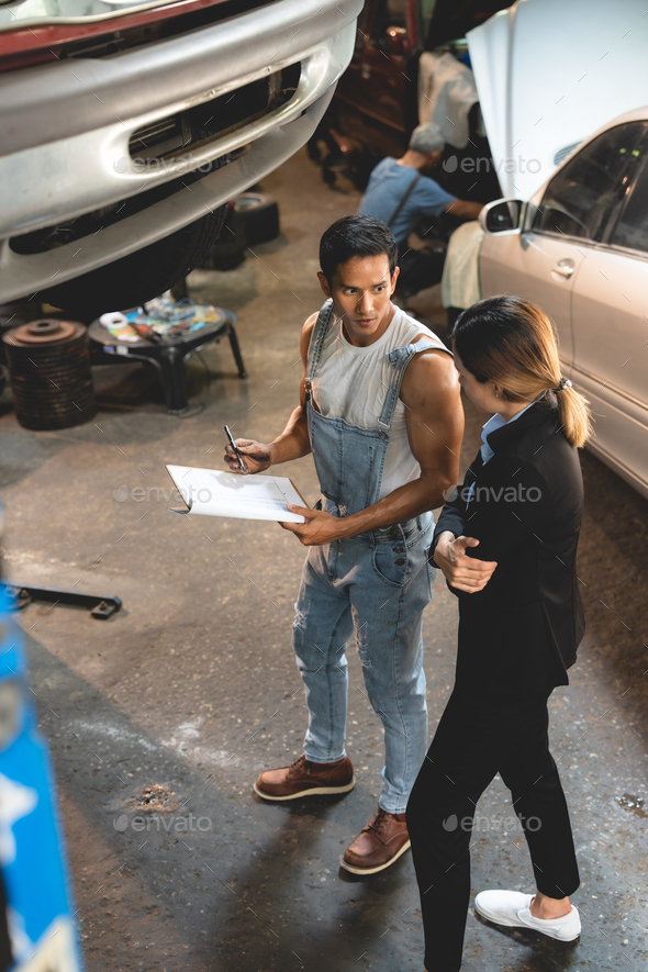 customer making inspection check to a car engine repair occupation job ...