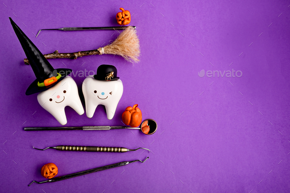 dental concept. figurines of teeth in halloween costumes and dental ...