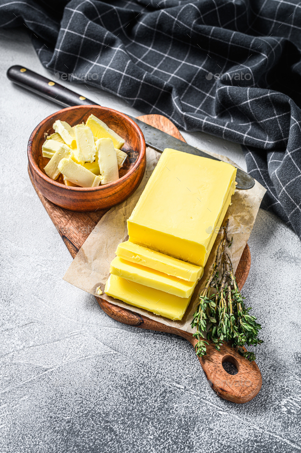 Block of fresh Butter, dairy farm products. Gray background.Top view ...