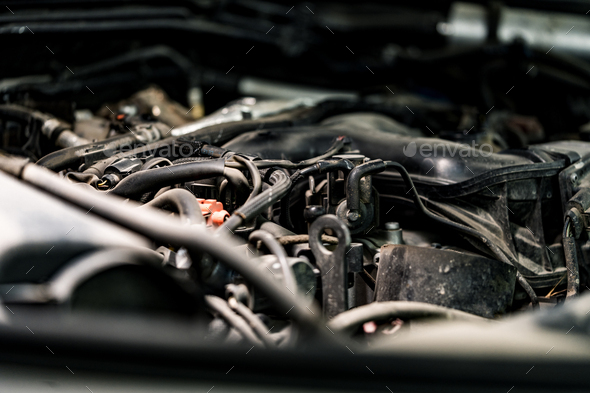 View of engine and other parts under the open hood of a car Stock Photo ...