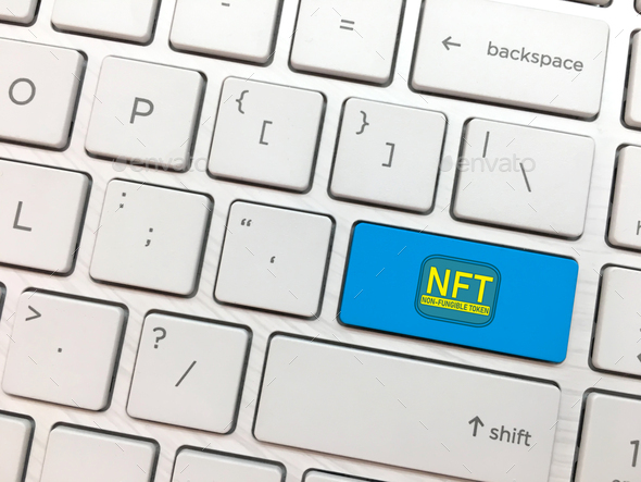 Computer keyboard enter button with NFT symbol. non fungible tokens ...