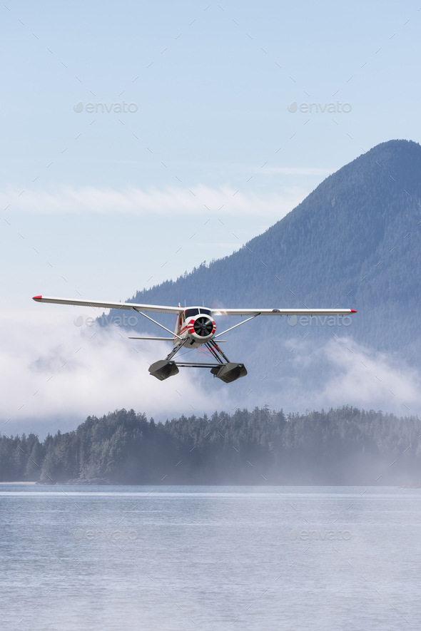 Seaplane Flying over the West Coast Pacific Ocean. Adventure Composite ...