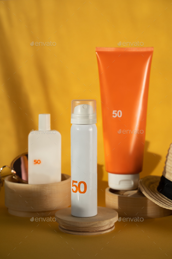 Sunscreen packaging on natural podium with sunlight Stock Photo by NAudigie