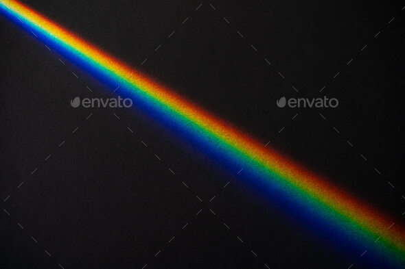 Rainbow streak on black textured paper background Stock Photo by NAudigie