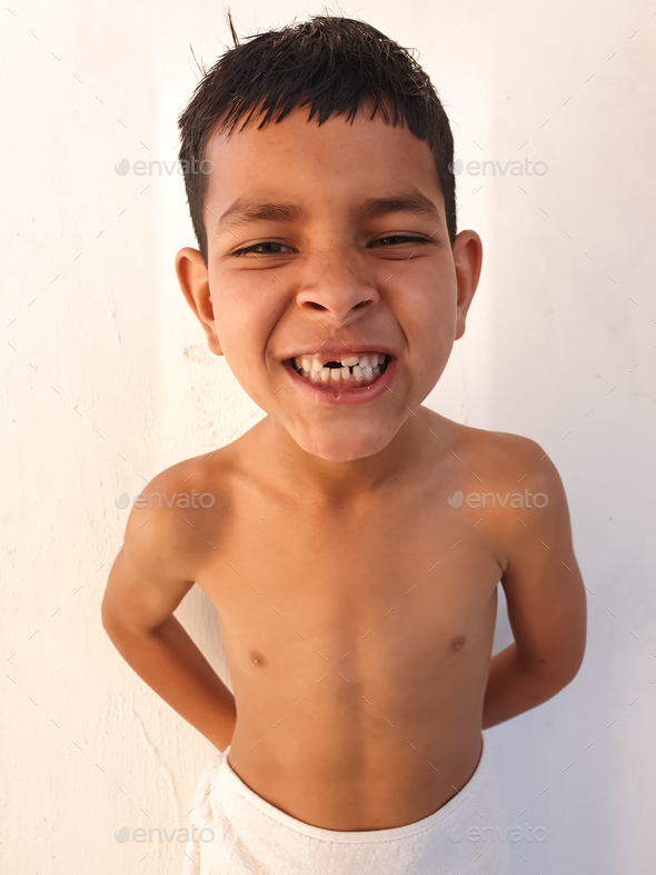 Studio shot of a shirtless little boy with funny big smile pose Stock ...