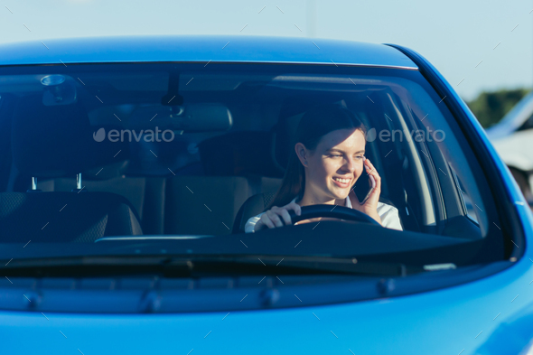portrait of a successful and happy woman driving a car, photo from the ...