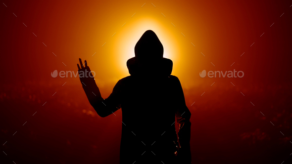Silhouette of alien waving hand - hello on orange background.Humanoid ...