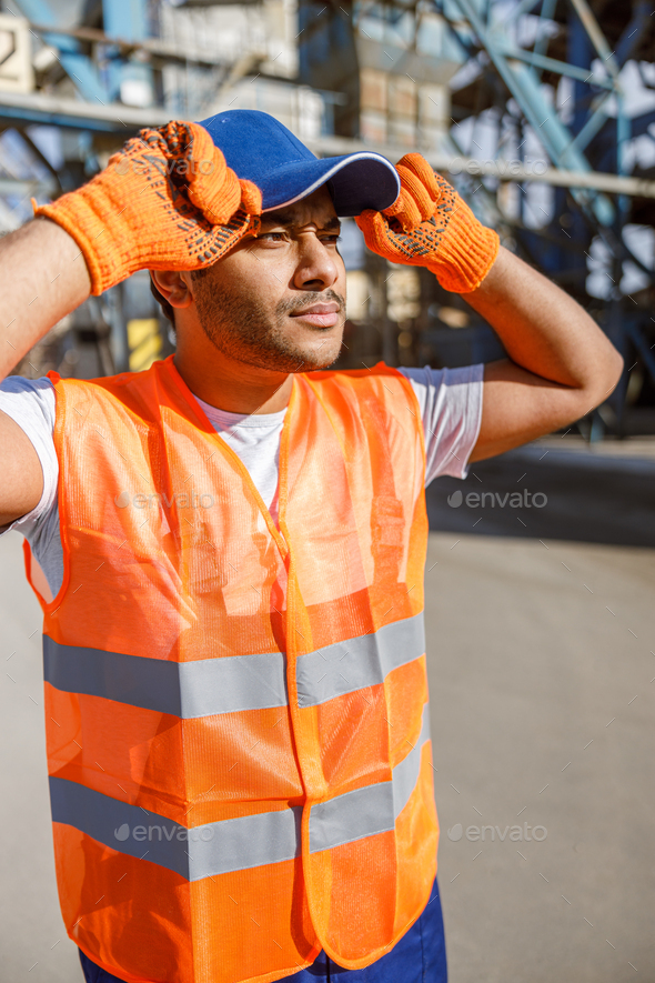 Serious construction worker observing construction site of plant Stock ...