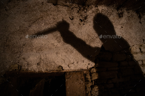 murderer with big knife and shadow horror scene Stock Photo by melis82