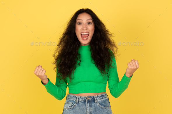 Emotional Arabic Female Gesturing Yes Shouting In Joy, Yellow ...