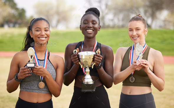 Cropped portrait of three attractive young female athletes celebrating ...