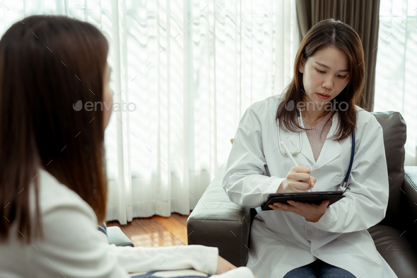 Asian woman patient discussing health with doctor checkup exam medical ...
