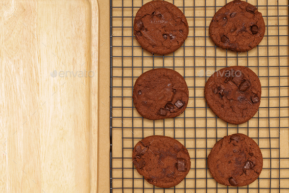 Flat lay of homemade sweets, Chocolate cookies on rack with wooden tray ...