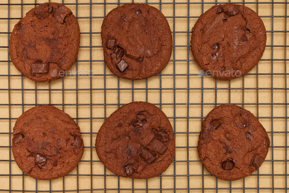 Flat lay of homemade sweets, Chocolate cookies on rack with wooden tray ...