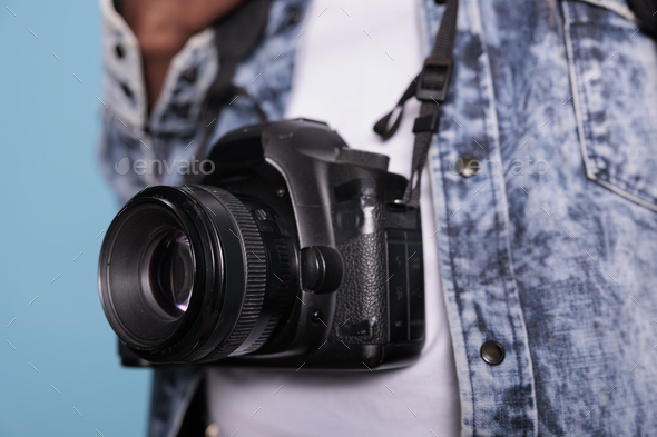 Close up shot of photography enthusiast wearing fashion denim jacket ...