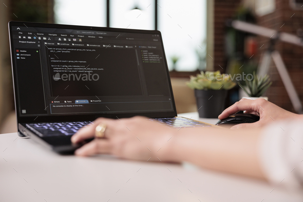 Programmer using terminal window with code Stock Photo by DC_Studio