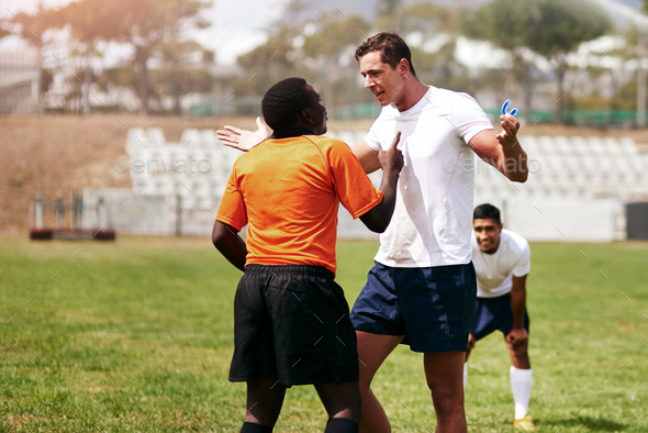 Shot of a young man arguing with the referee during a rugby game Stock ...