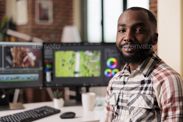 Portrait of freelancer working on video editing Stock Photo by DC_Studio