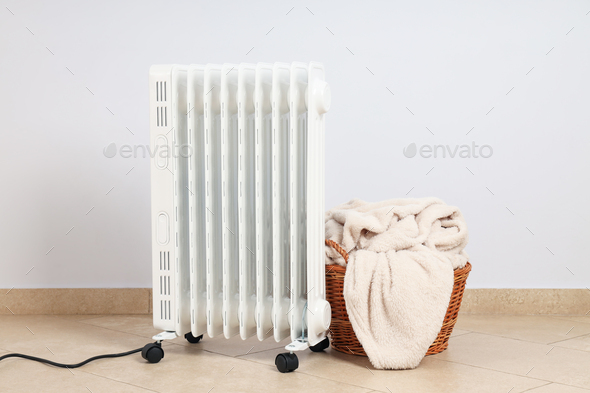 Concept of heating season, modern electric heater in room Stock Photo ...