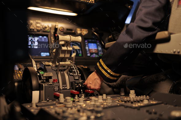 Woman airliner pushing dashboard buttons in plane cockpit Stock Photo ...