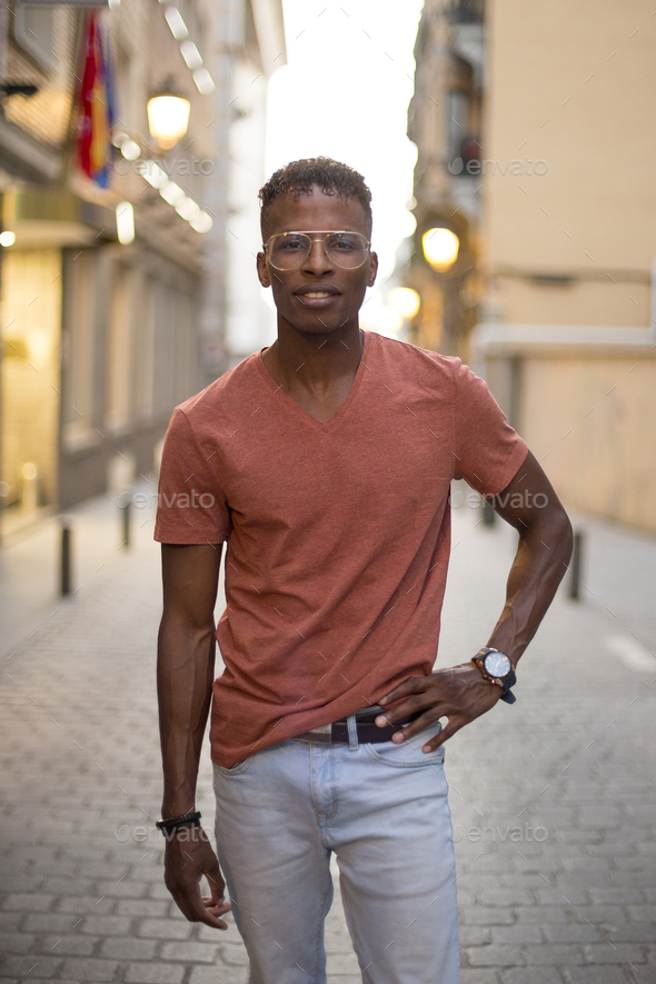 Portrait of a modern african man posing in the street Stock Photo by ...