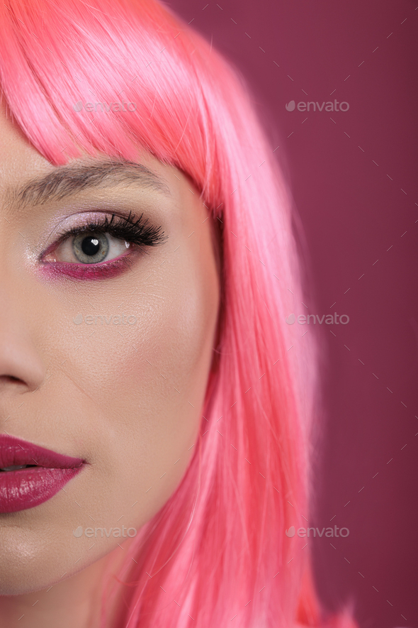 Portrait of beauty model showing half of face on camera in studio Stock ...