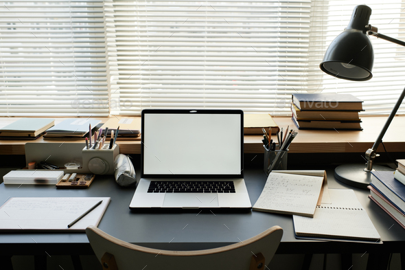 Laptop on students table Stock Photo by Media_photos | PhotoDune