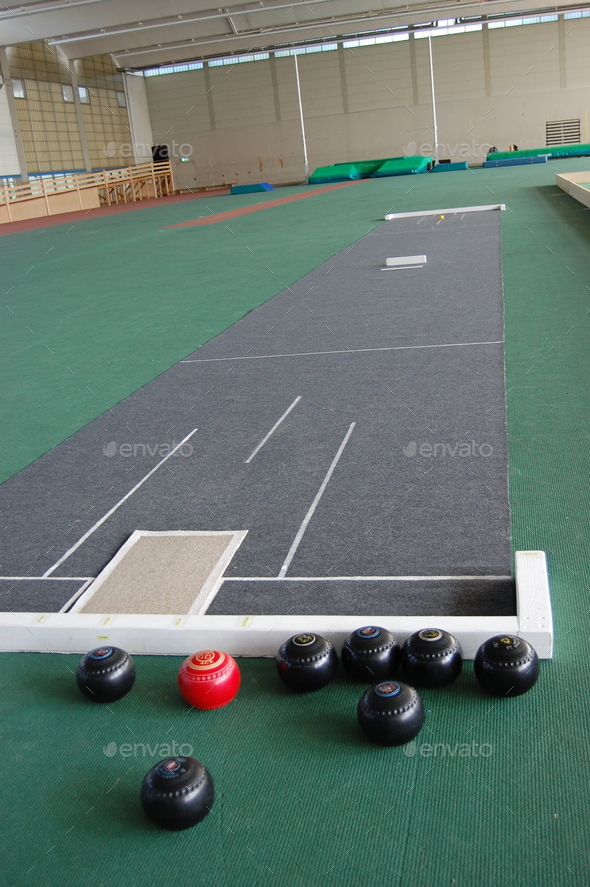 a set of lawn bowls / short mat on a green floor, indoor Stock Photo by ...