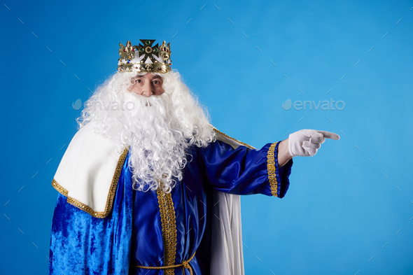 The Magician King pointing to a billboard on a blue background Stock ...