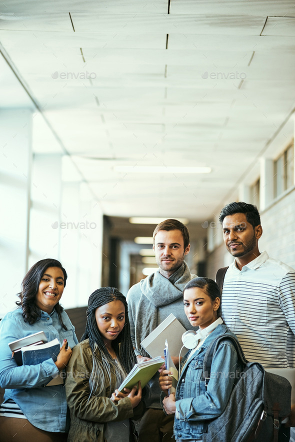 Cropped portrait of a group of university students standing in a campus ...