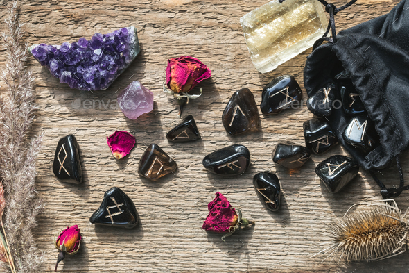 Set of different crystals and rune stones on wood Stock Photo by Portoprens
