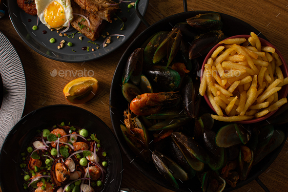 Table full of plates with food. Table to go eat. Aerial view of a ...