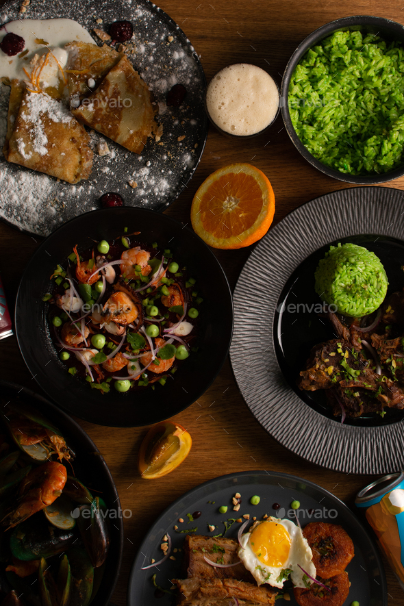 Table full of plates with food. Table to go eat. Aerial view of a ...