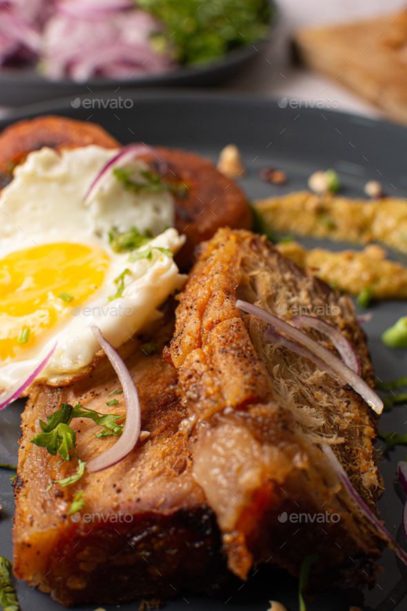 Porkbelly. Fried pig. Crispy meat. Juicy pork. Accompanied by fried egg ...