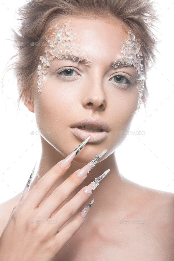 Beautiful fashion model with long nails, creative makeup and manicure ...